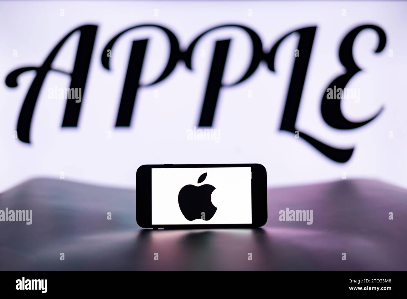 In this photo illustration, the Apple logo is seen displayed on a ...
