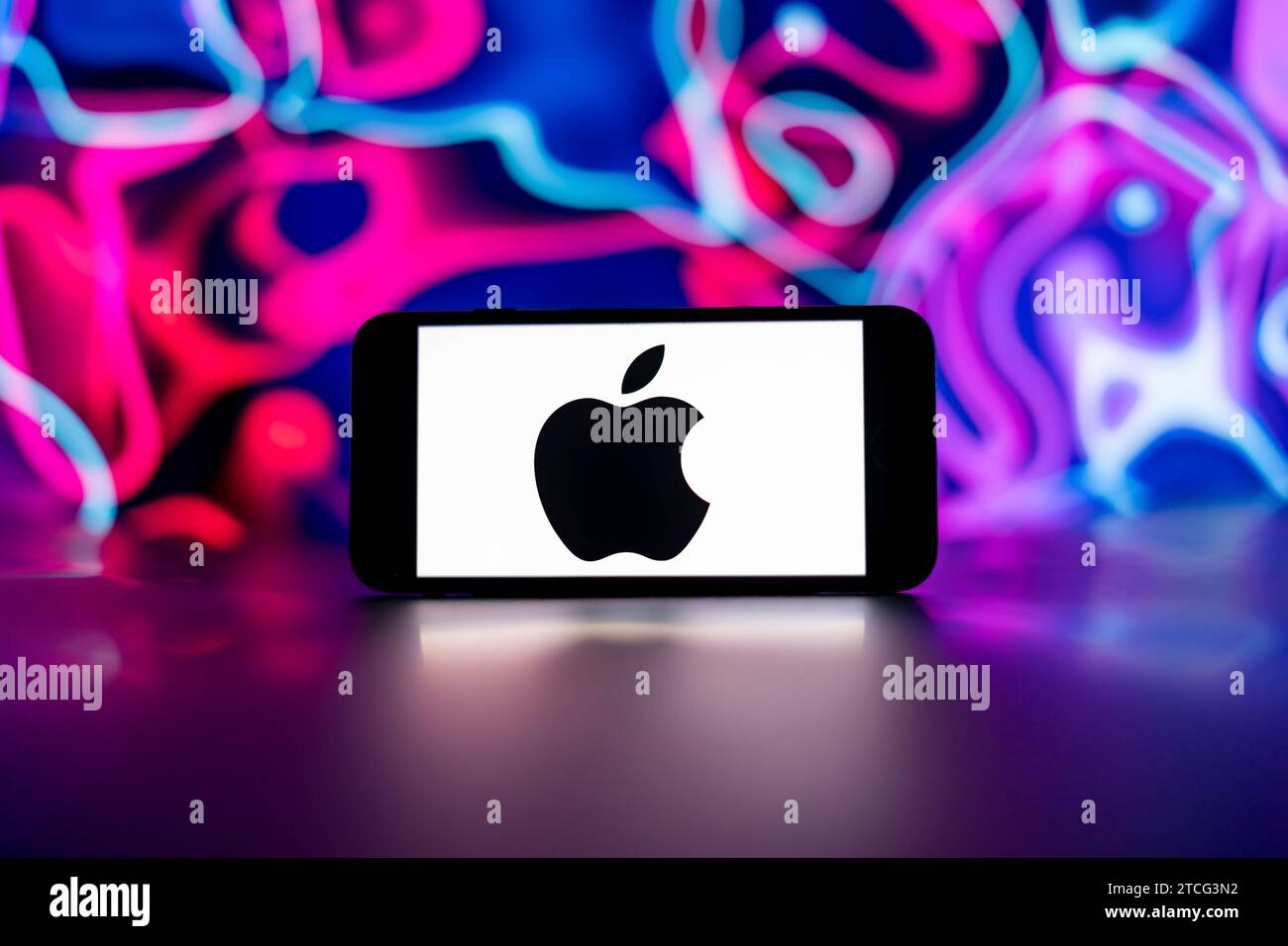 In this photo illustration, the Apple logo is seen displayed on a ...