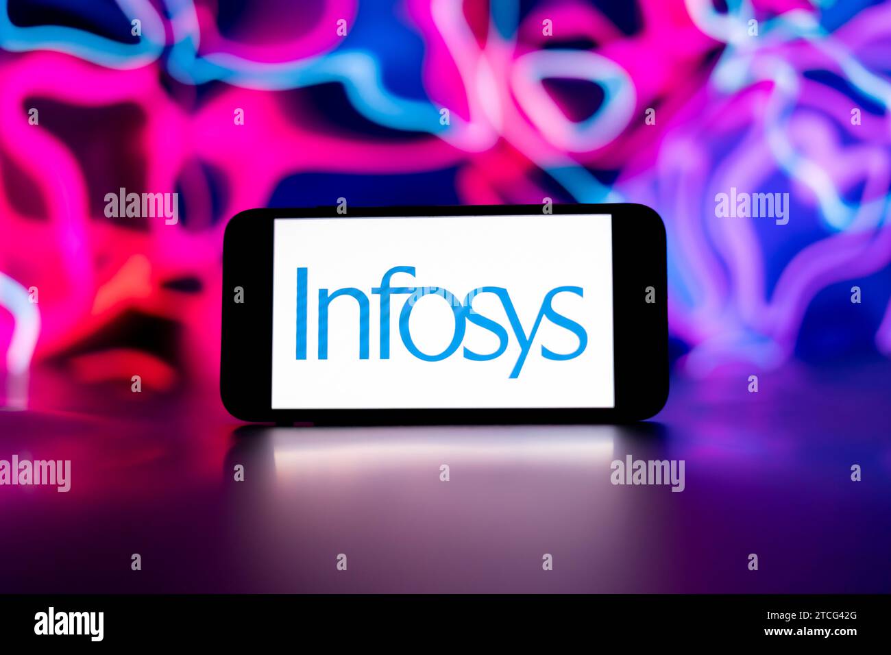 In this photo illustration, the Infosys logo is seen displayed on a ...