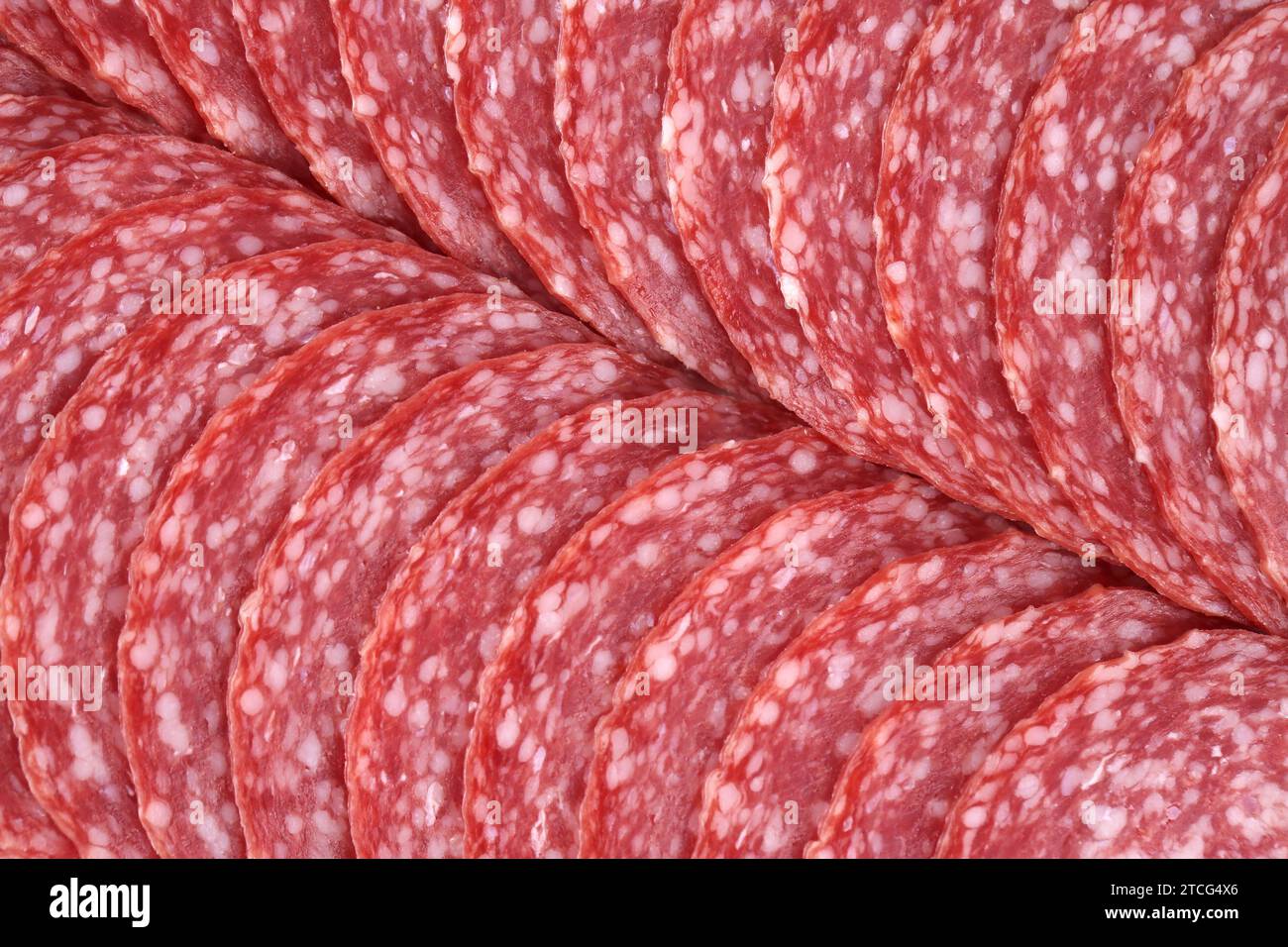 Sliced salami texture as a background, horizontal image Stock Photo - Alamy