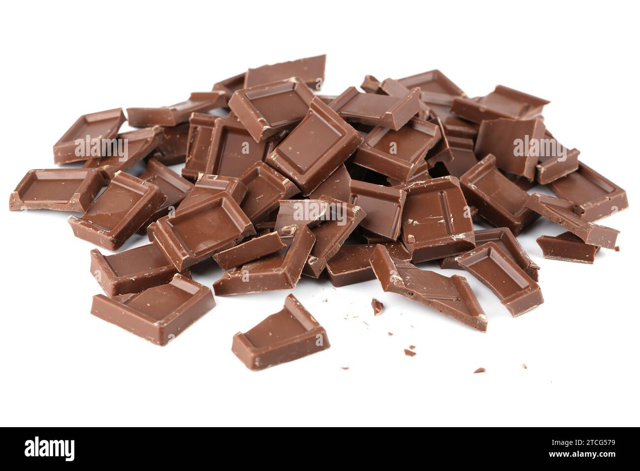 Heap of chocolate chunks on white background Stock Photo - Alamy