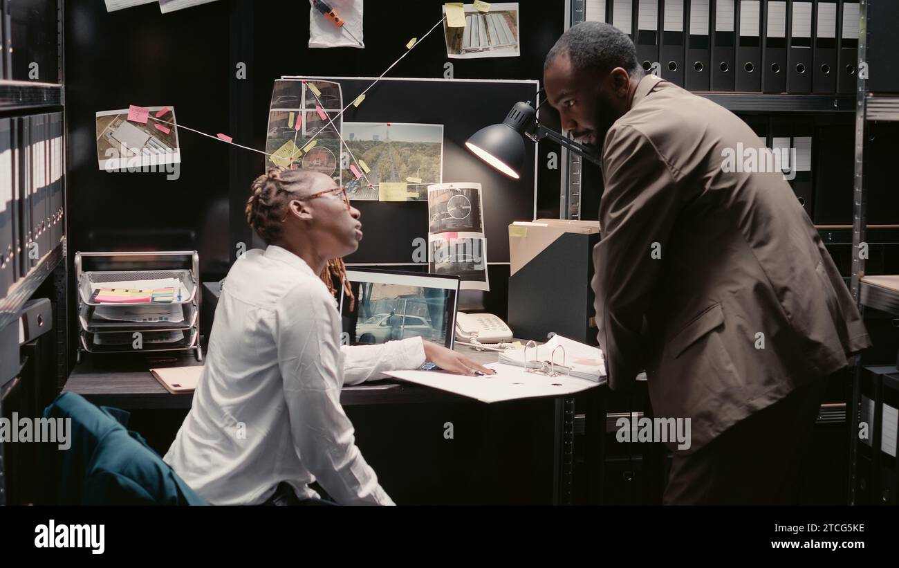 Detectives team conducting private investigation in incident room ...