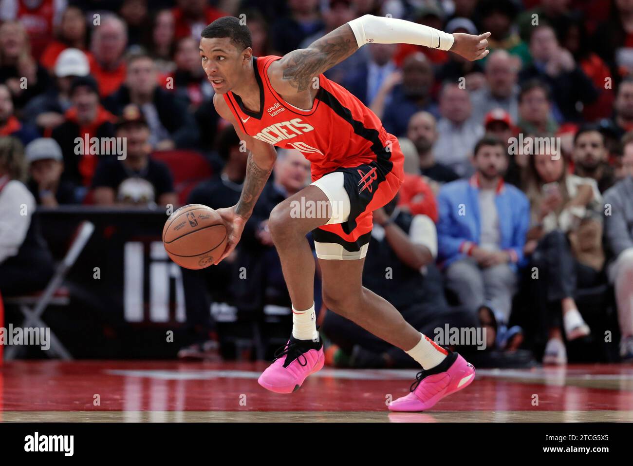 Houston Rockets forward Jabari Smith Jr. scoops up a loose ball against ...