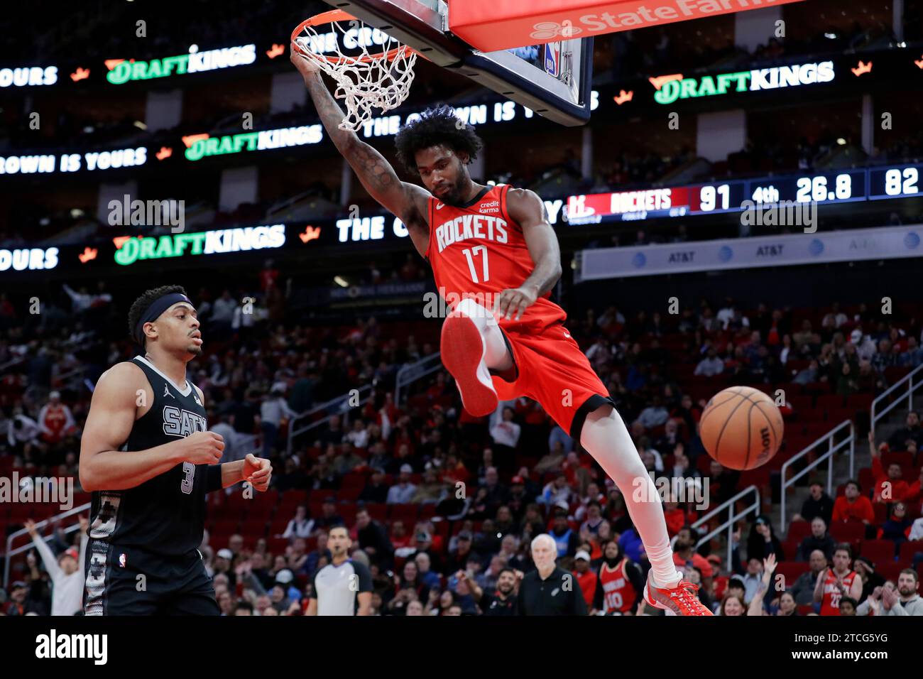 Houston Rockets forward Tari Eason (17) hangs on the rim after dunking ...