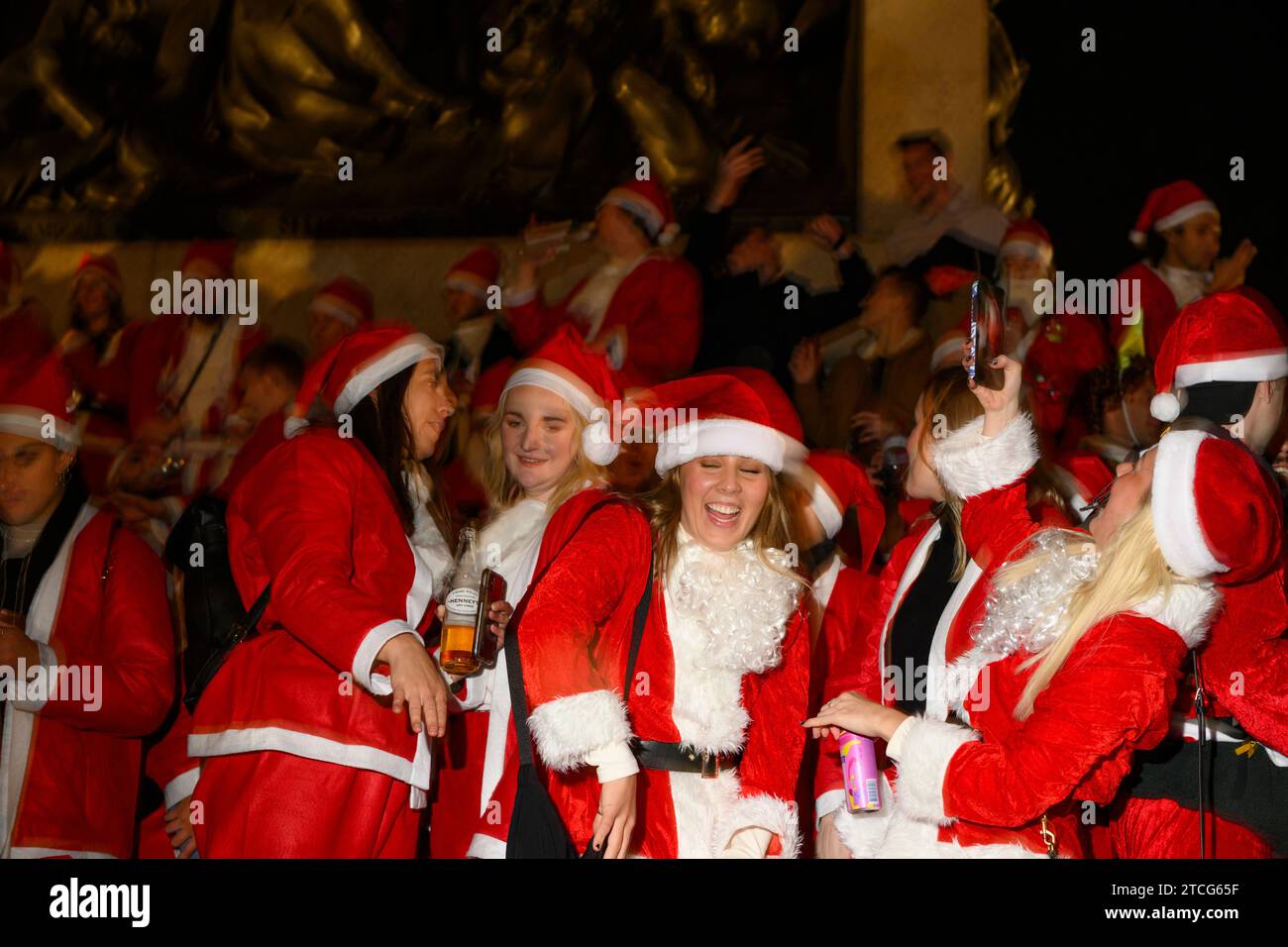 People taking part in SantaCon at Trafalgar Square, which involves ...