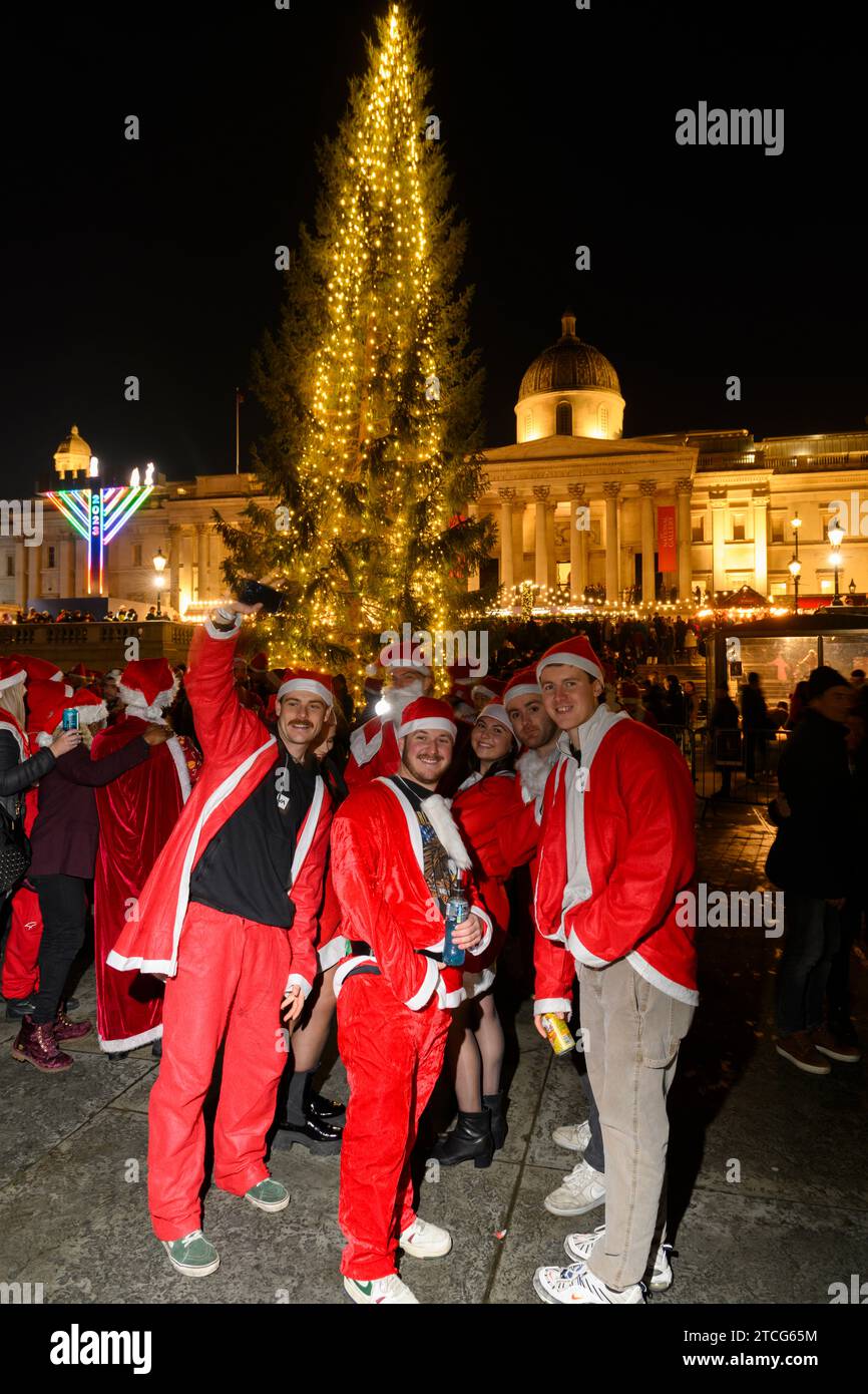 People taking part in SantaCon at Trafalgar Square, which involves ...