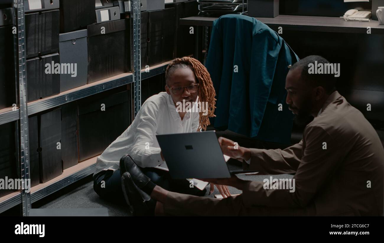 Private investigators working on police case with clues with physical ...