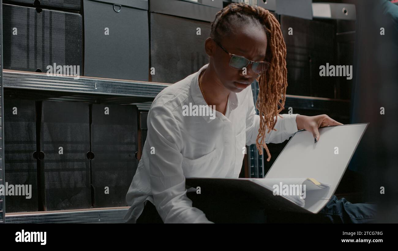 Criminal detective examining surveillance photos clues, analyzing ...