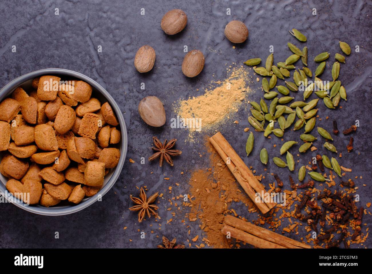 Flat lay of spices on a dark background. Top to bottom Nutmeg, White ...