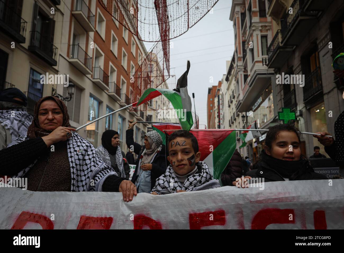 A child is seen with his face painted with pro Palestine messages in ...