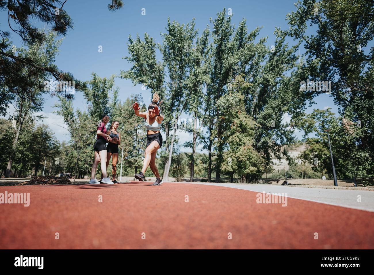 Female Athletes Having Fun Exercising Outdoors in a Sunny Park. They ...