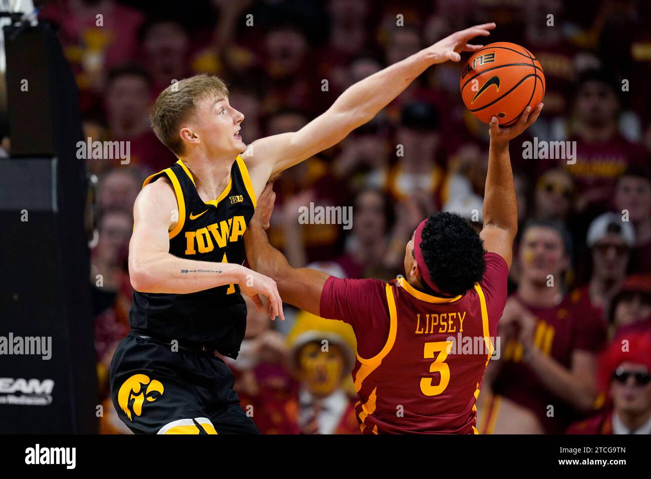 Iowa guard Josh Dix blocks a shot by Iowa State guard Tamin Lipsey (3 ...