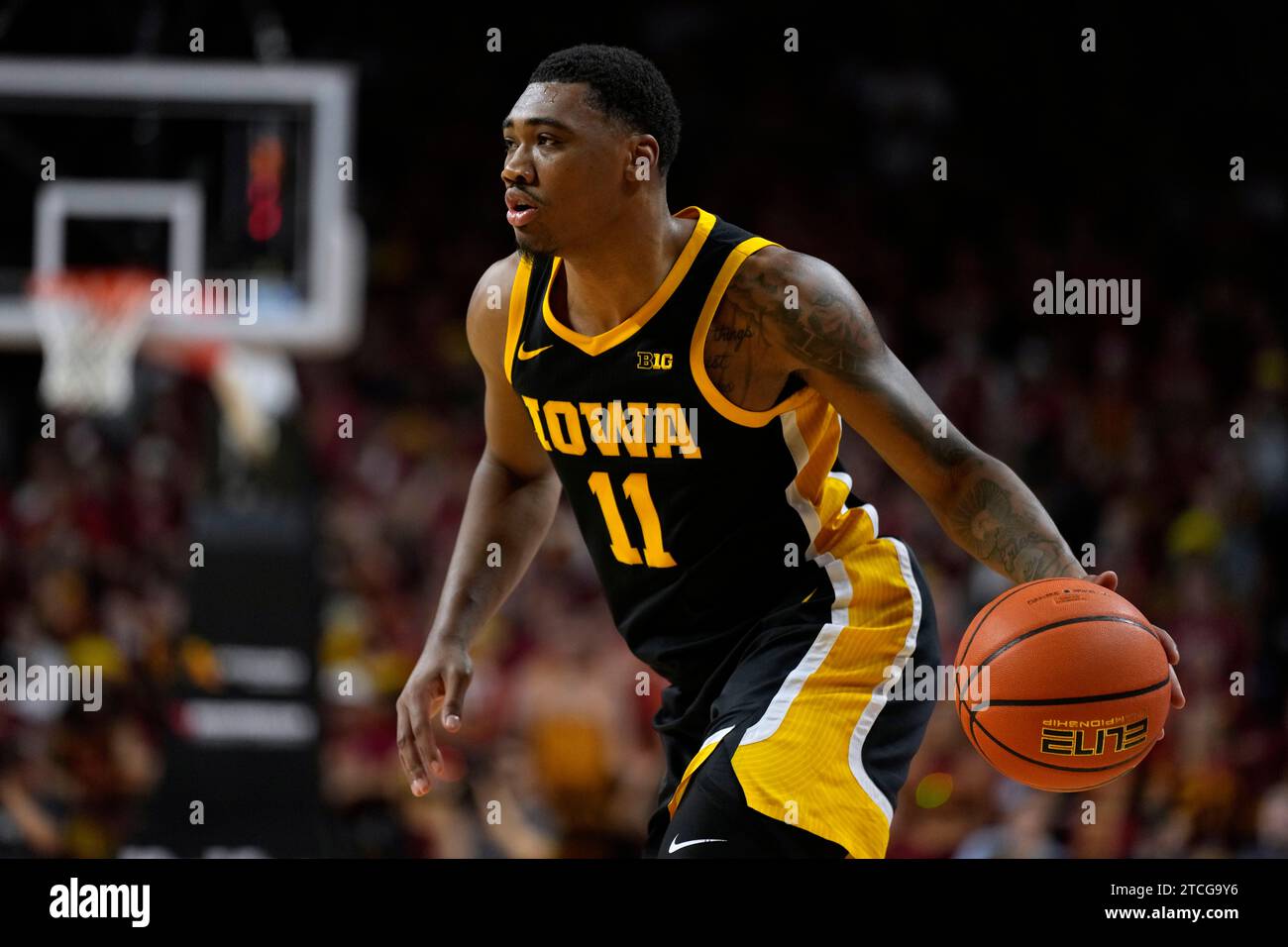 Iowa guard Tony Perkins (11) drives to the basket during the first half ...