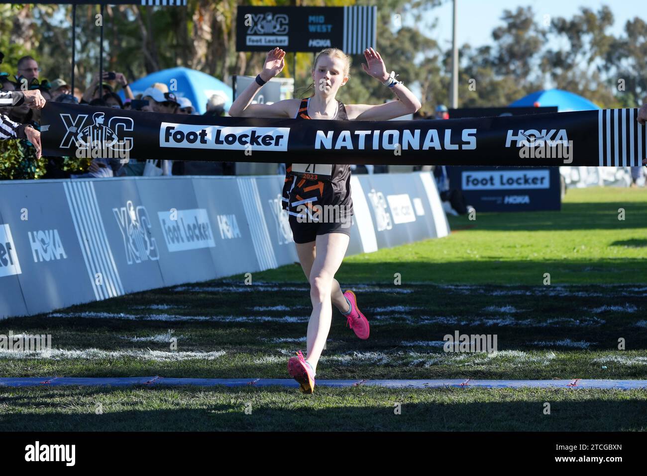 Elizabeth Leachman celebrates after winning the girls race in 16:50.7 ...