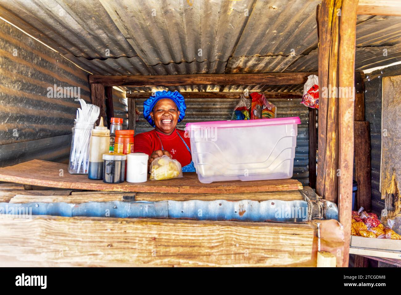 african woman selling potato chips in a shack in a village, Street ...