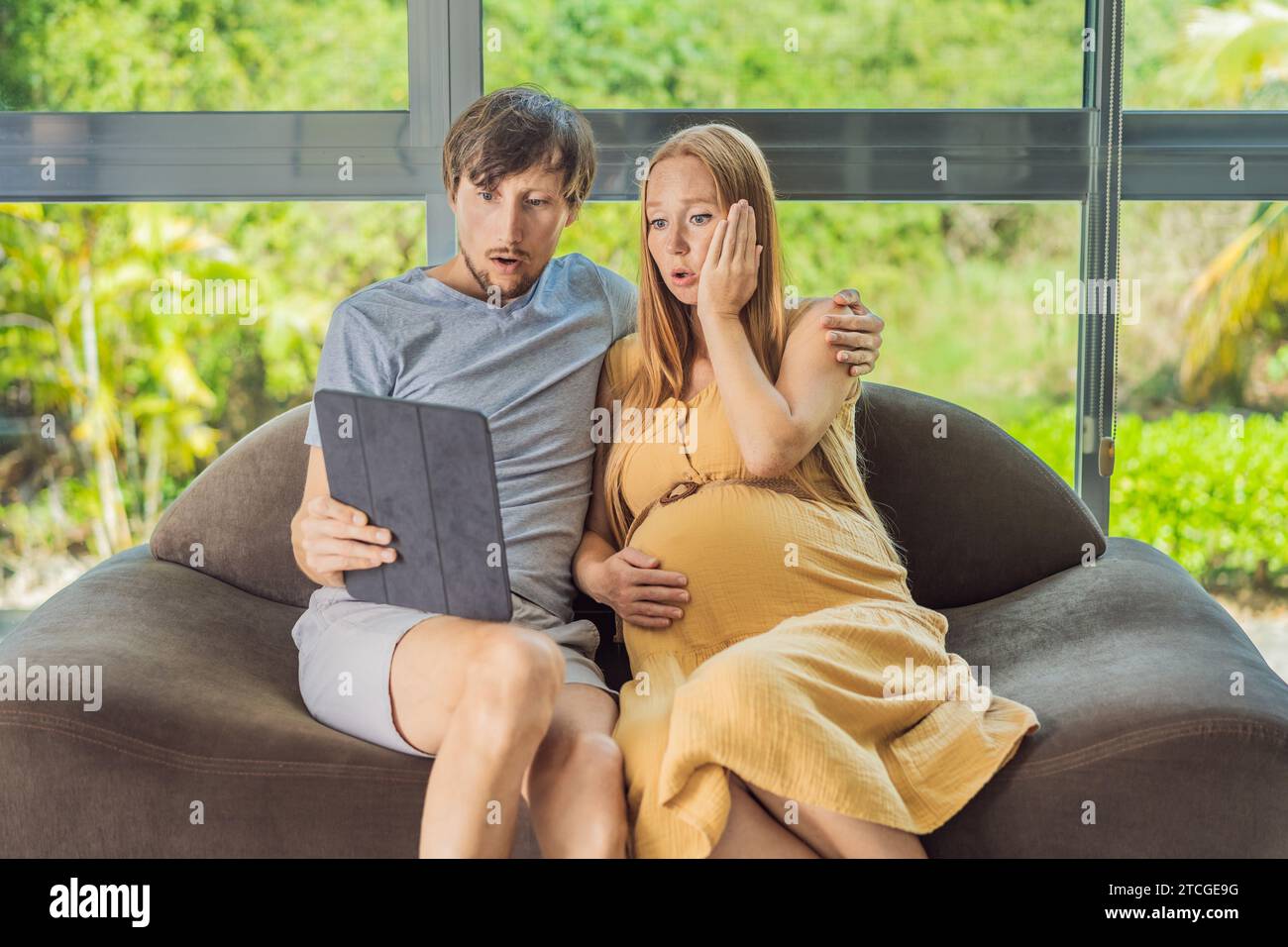 Cost of Pregnancy And Family Budgeting Concept. Young couple expecting ...