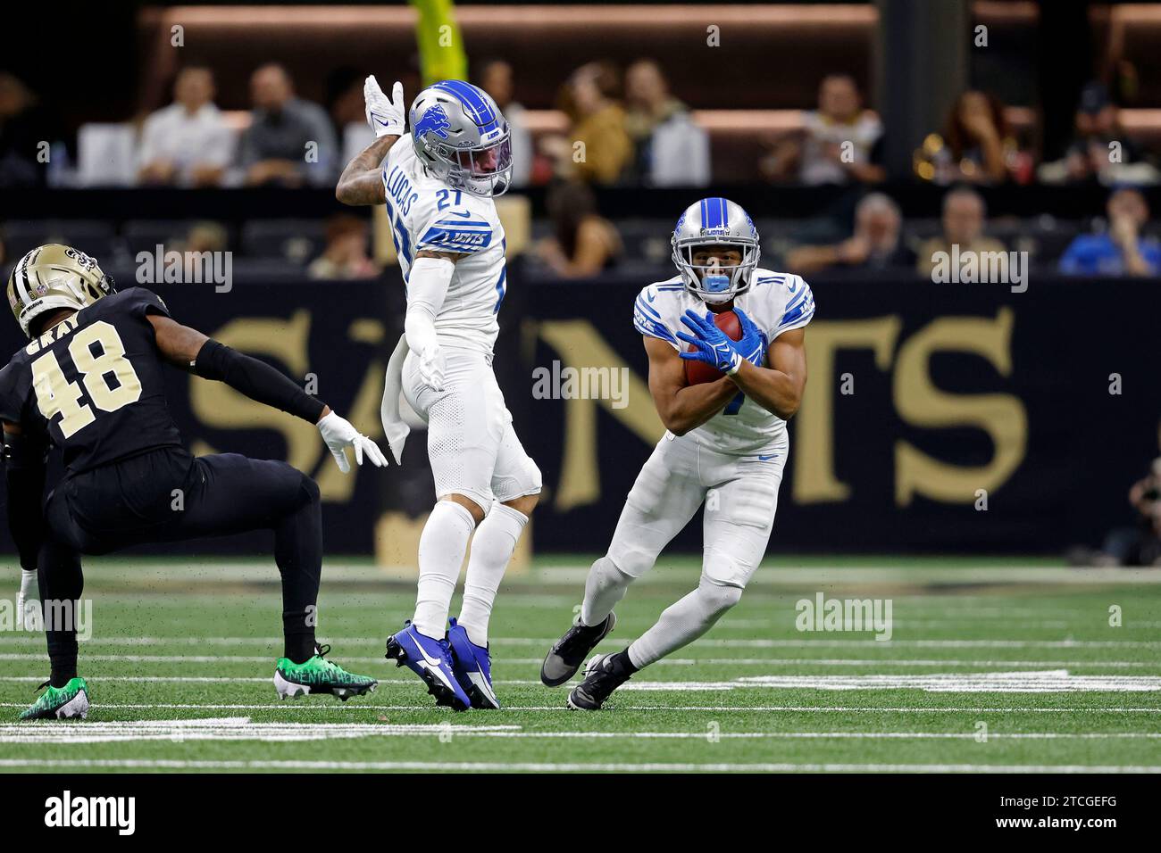 Detroit Lions wide receiver Kalif Raymond (11) and cornerback Chase ...