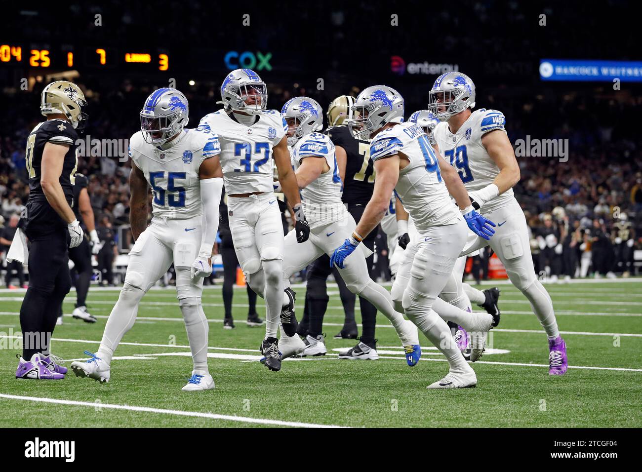 Detroit Lions linebacker Derrick Barnes (55), safety Brian Branch (32 ...
