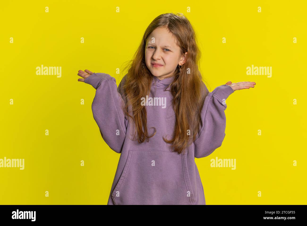 What. Why. Young redhead school girl raising hands in indignant ...