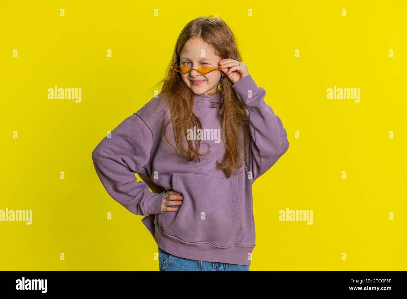 Playful happy young preteen child girl kid wearing orange sunglasses ...