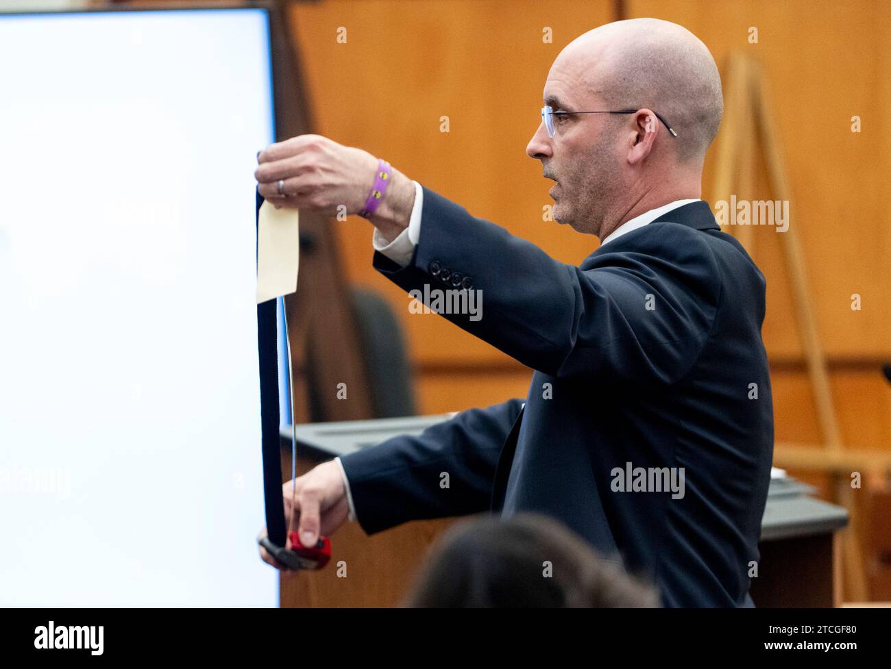 Defense attorney Jared Ausserer measures the hobble used on Manny Ellis ...