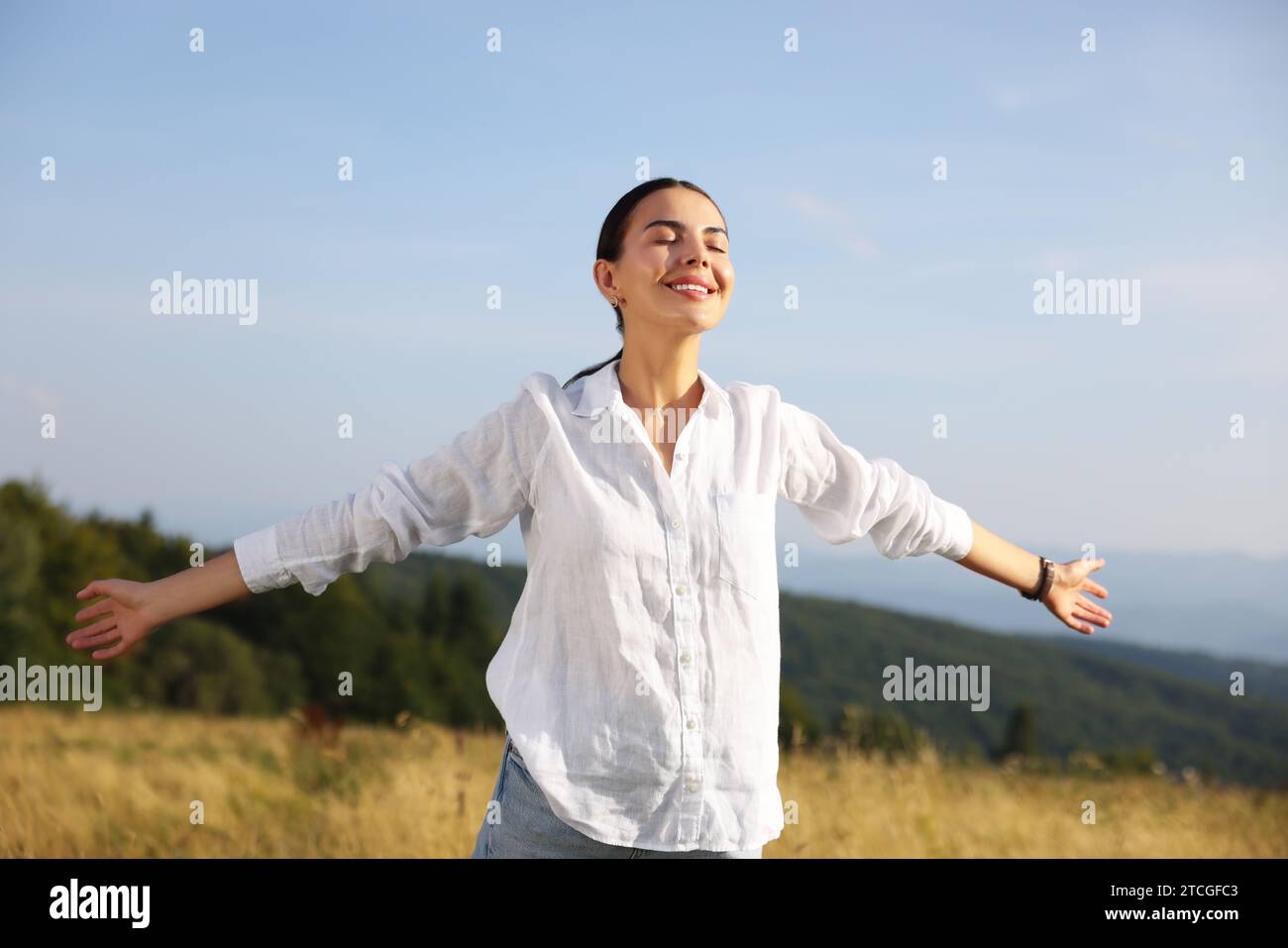 Feeling freedom. Happy woman with wide open arms outdoors Stock Photo ...