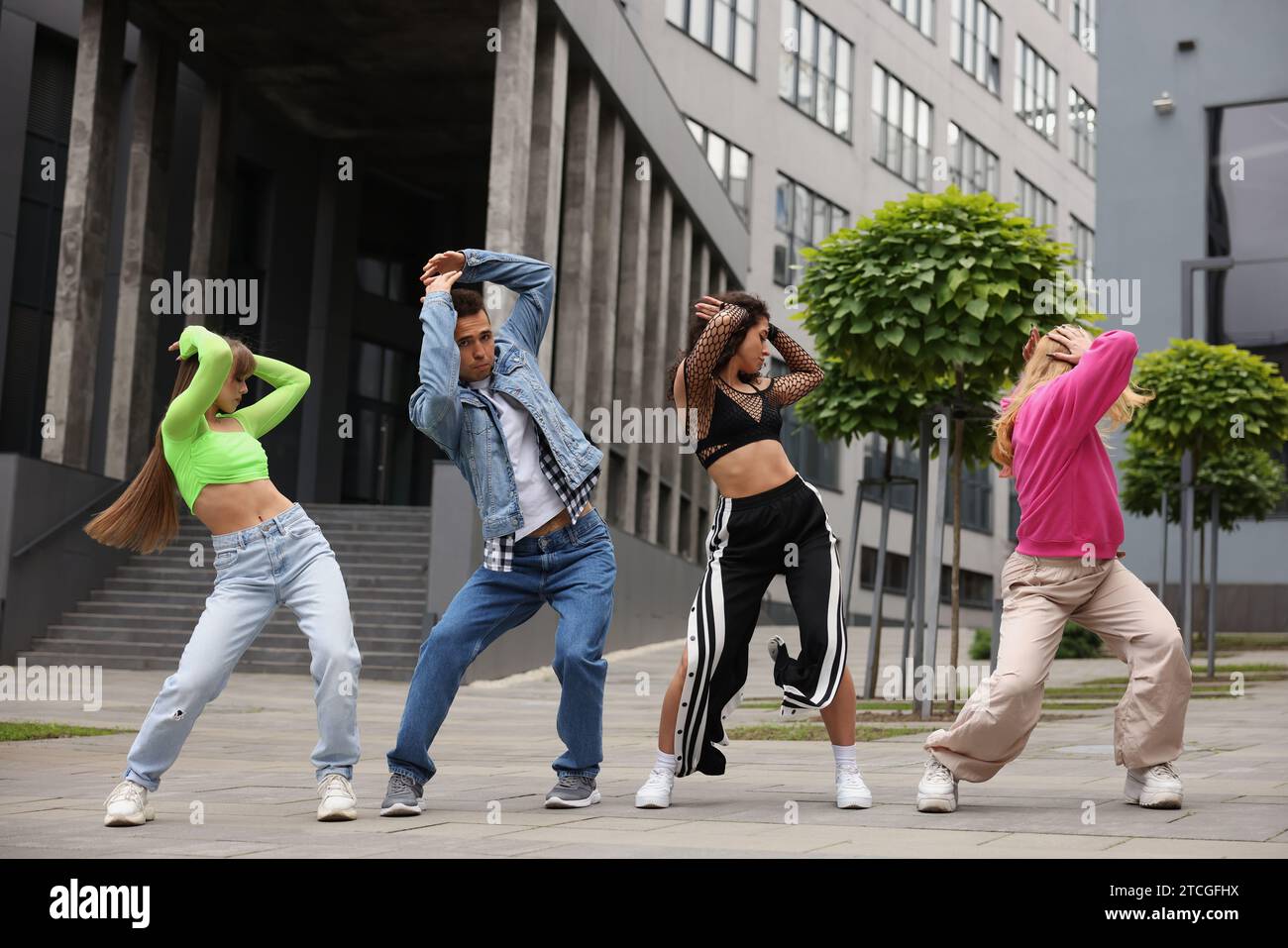 Group of people dancing hip hop outdoors Stock Photo - Alamy