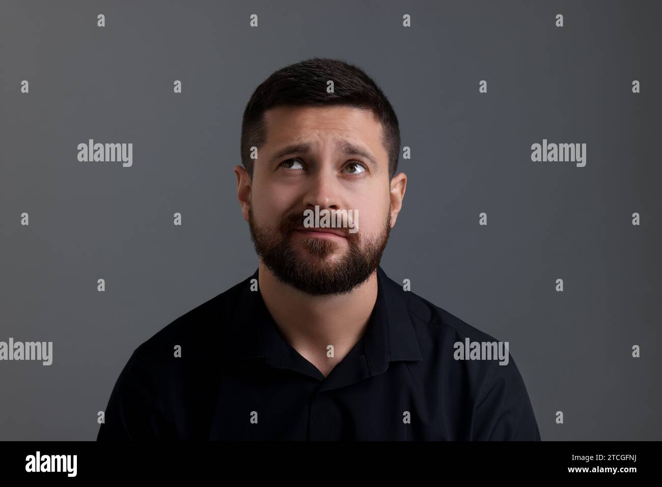 Personality concept. Emotional man on grey background Stock Photo - Alamy