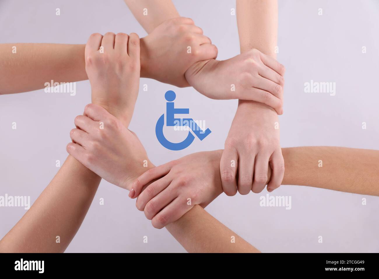 Inclusion concept. People holding hands together around international ...