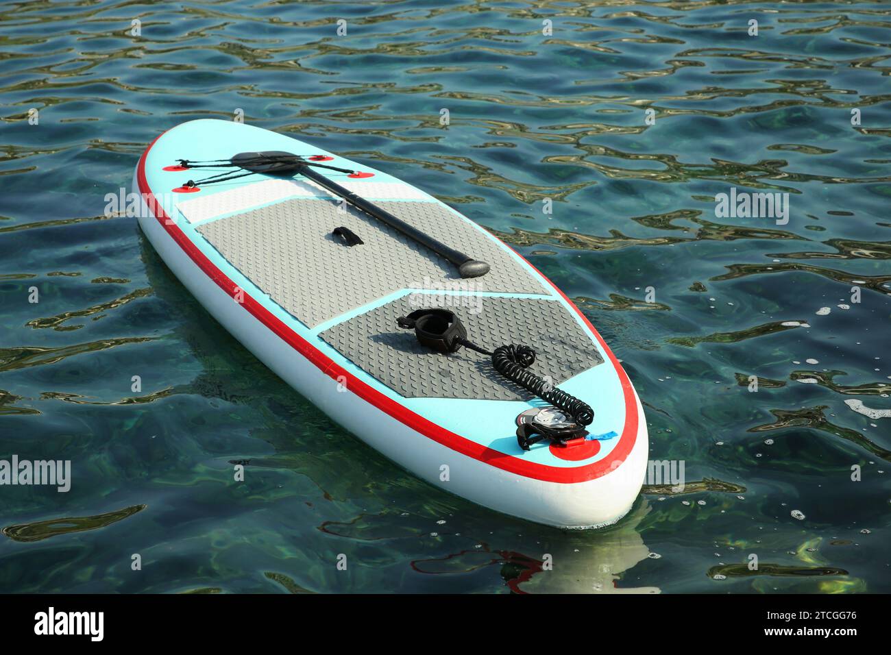 One SUP board with paddle on sea water Stock Photo - Alamy