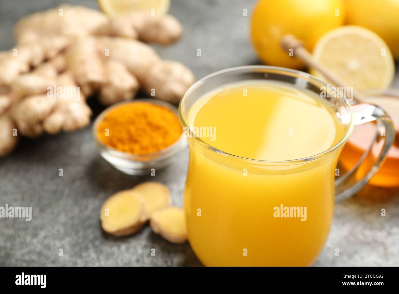 Immunity boosting drink and ingredients on grey table, closeup Stock ...