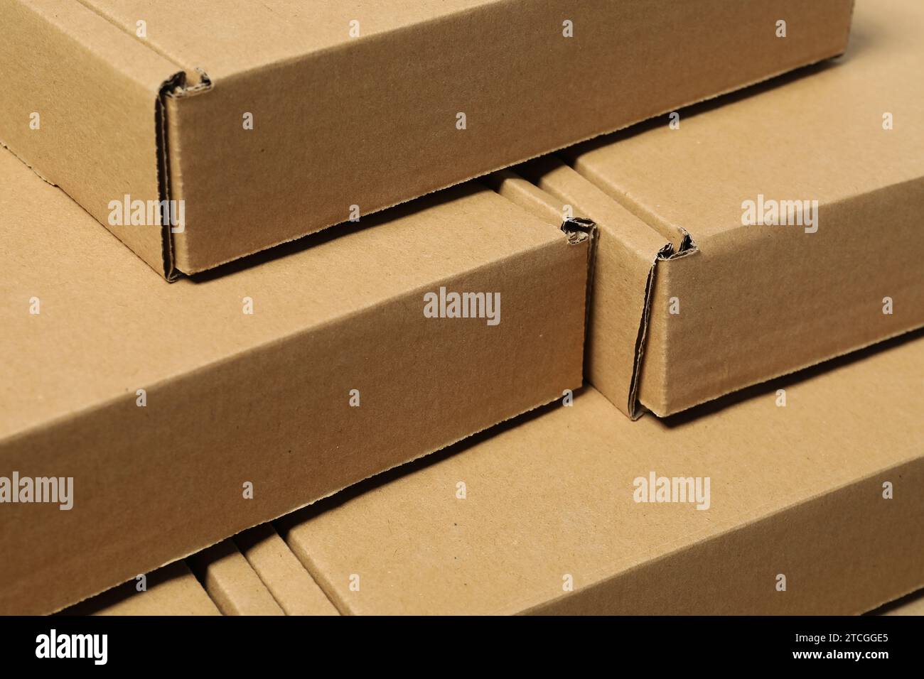 Many closed cardboard boxes as background, closeup Stock Photo - Alamy