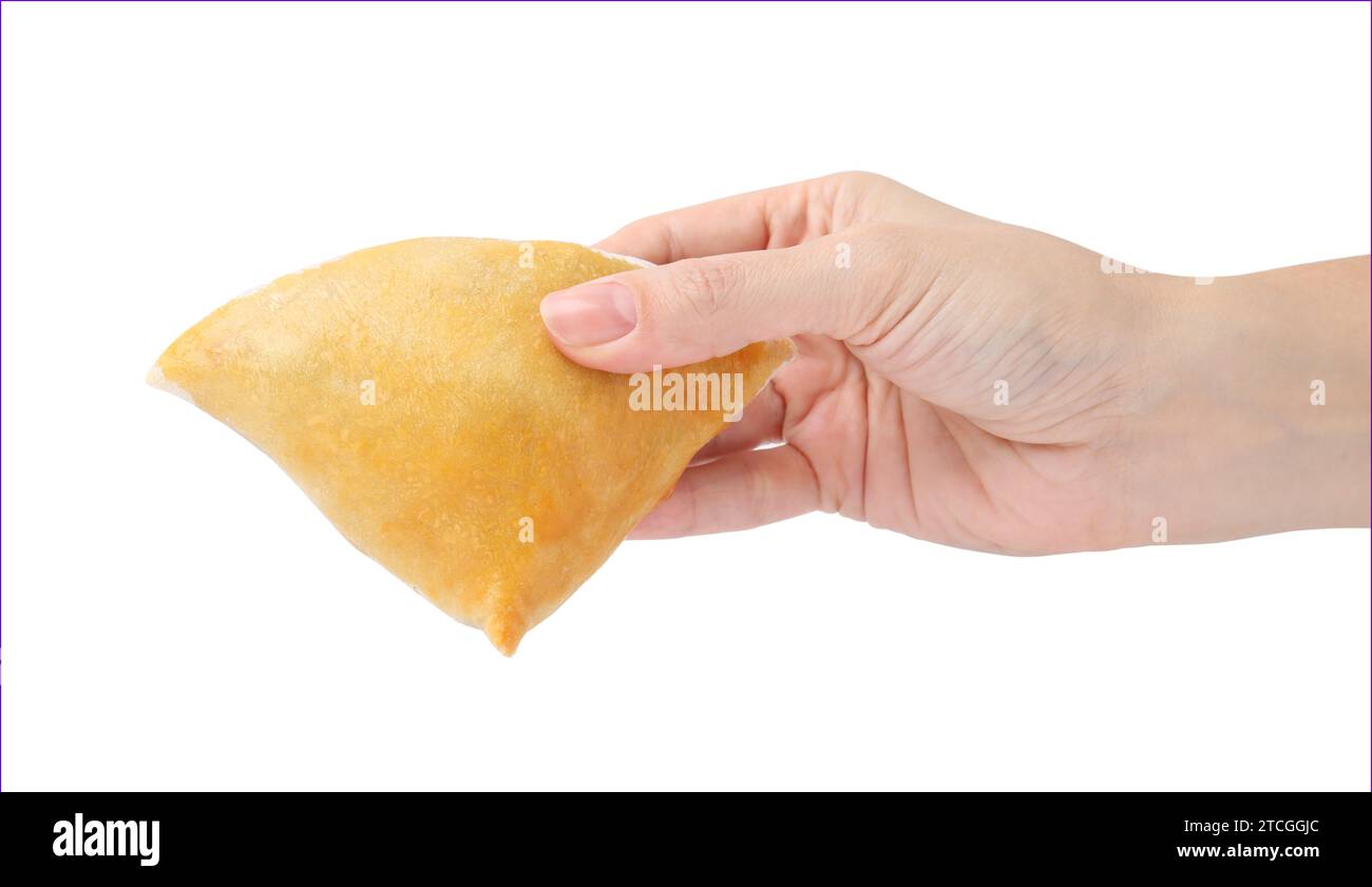 Woman holding delicious samosa on white background, closeup Stock Photo ...