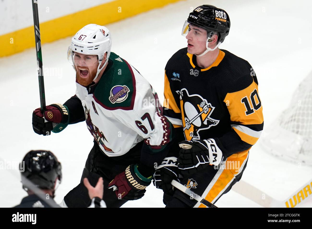 Arizona Coyotes' Lawson Crouse (67) celebrates his goal in front of ...