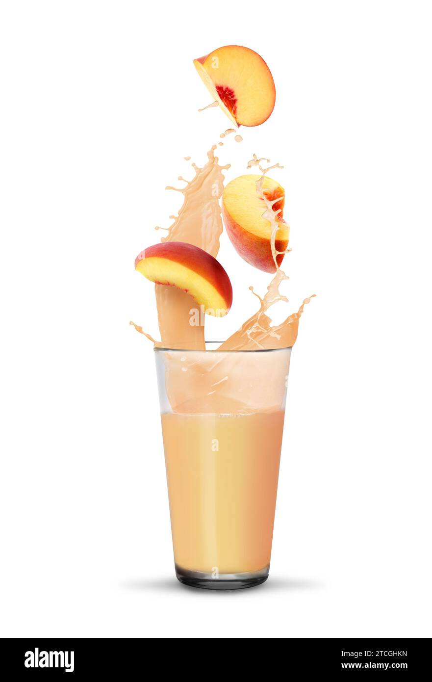 Fresh peach juice splashing from glass on white background Stock Photo ...