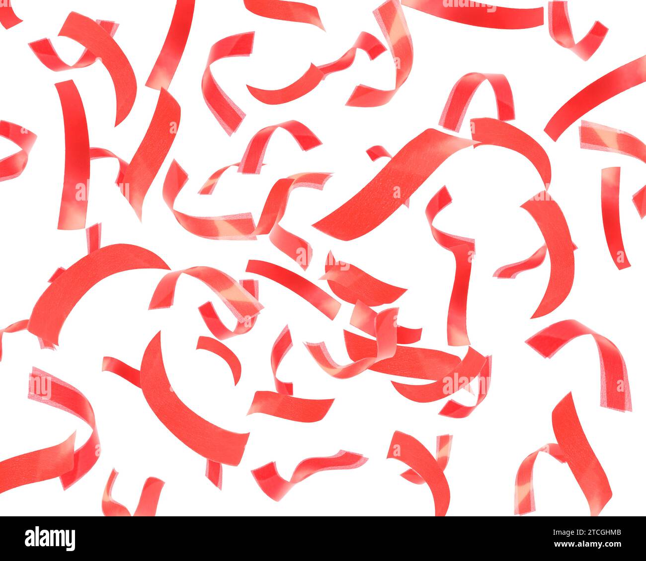 Bright red confetti falling on white background Stock Photo - Alamy