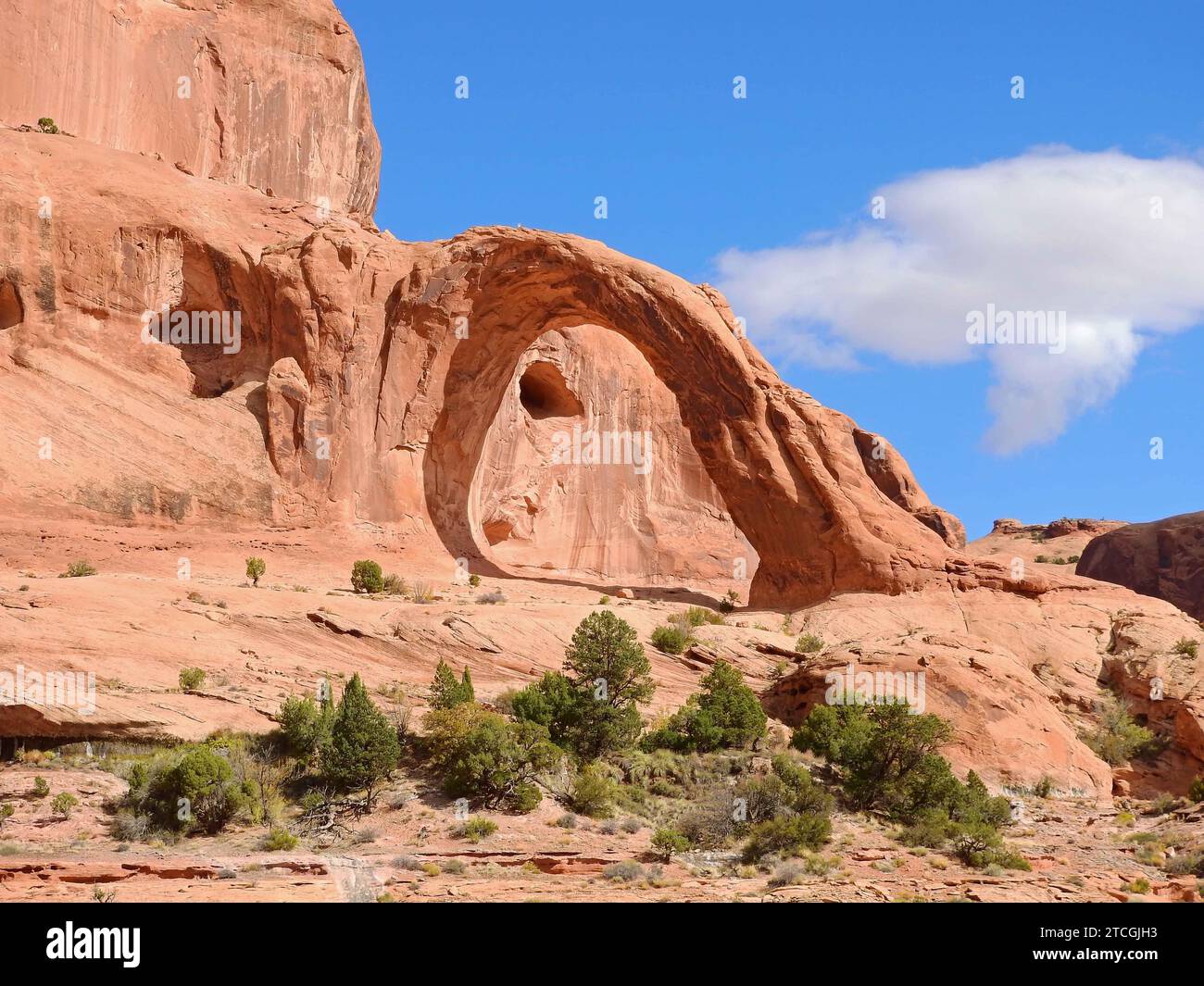 spectacular corona arch on a sunny fall day, in a side canyon off the ...