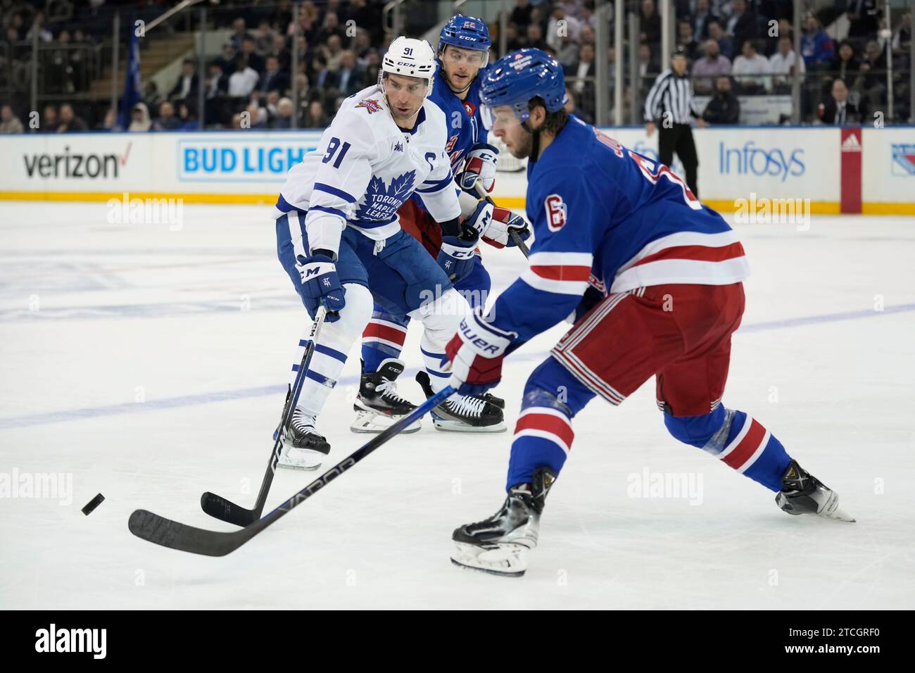 Toronto Maple Leafs' John Tavares (91) is defended by New York Rangers ...