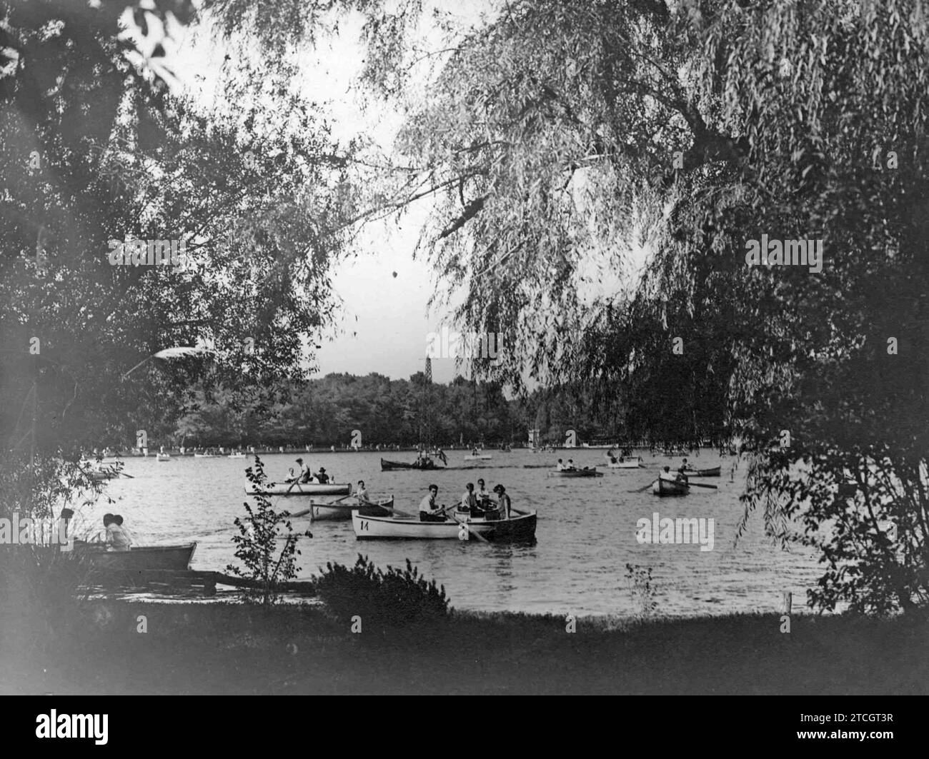 Madrid, 1926 (Ca.) View of the Retiro Park pond with people in boats ...