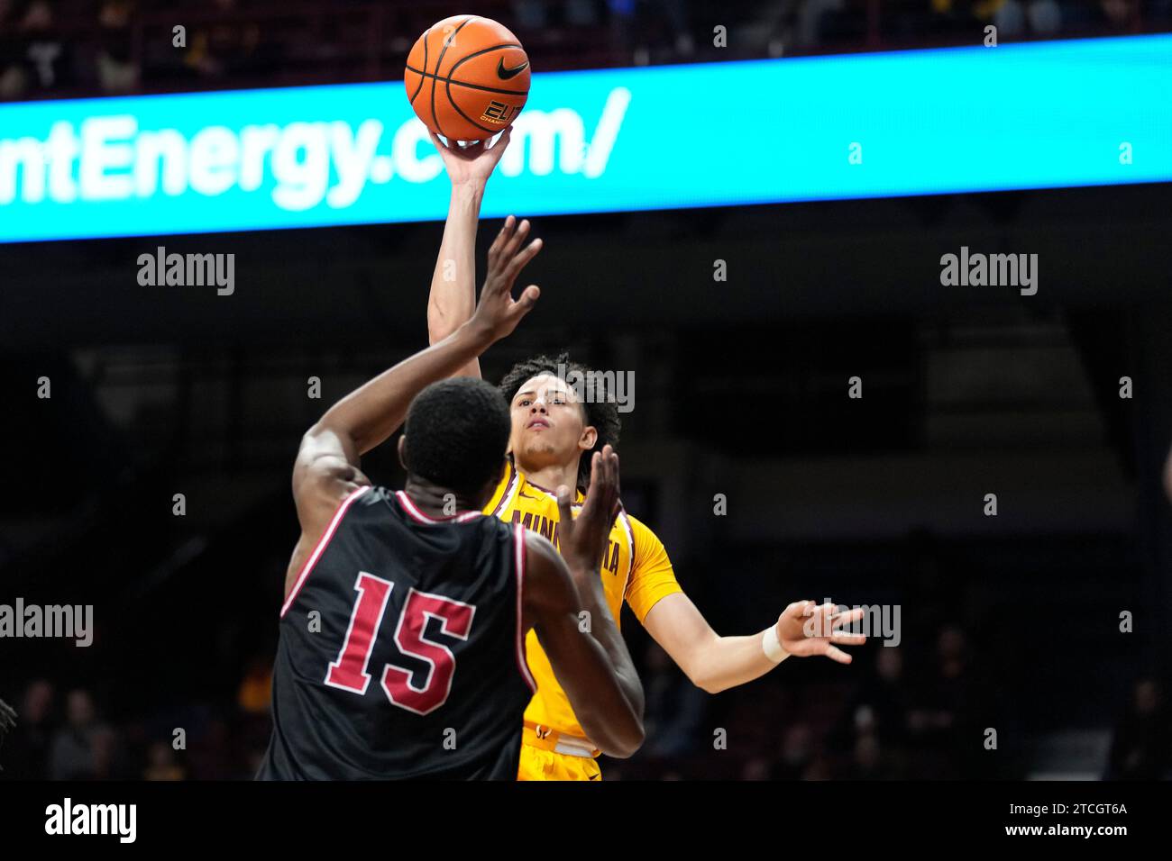 Minnesota guard Mike Mitchell Jr. attempts a shot as IUPUI center Yves ...
