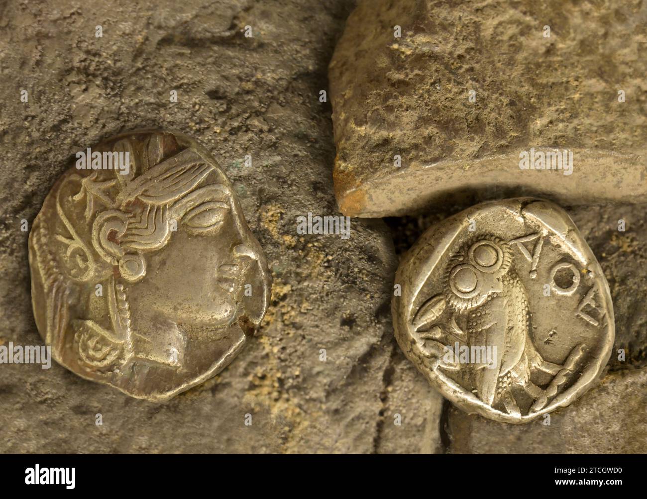 Silver ingot fragments with coins showing a portrait of Athena, the ...