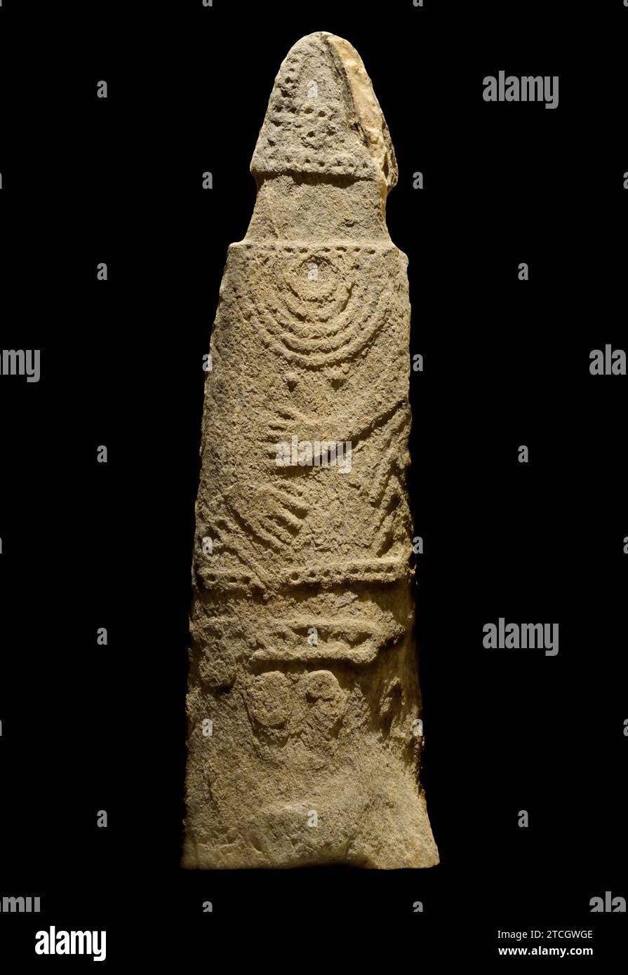 Bronze age stone menhir with a double-sided relief in human form ...
