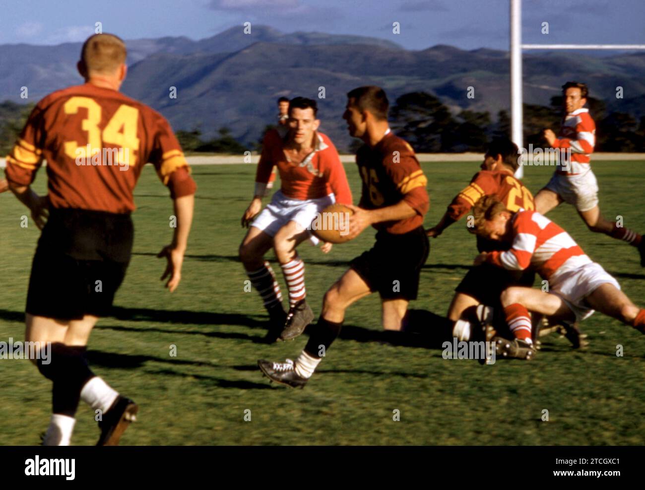 CARMEL, CA - MARCH, 1961: An unidentified Rugby player runs with the ...