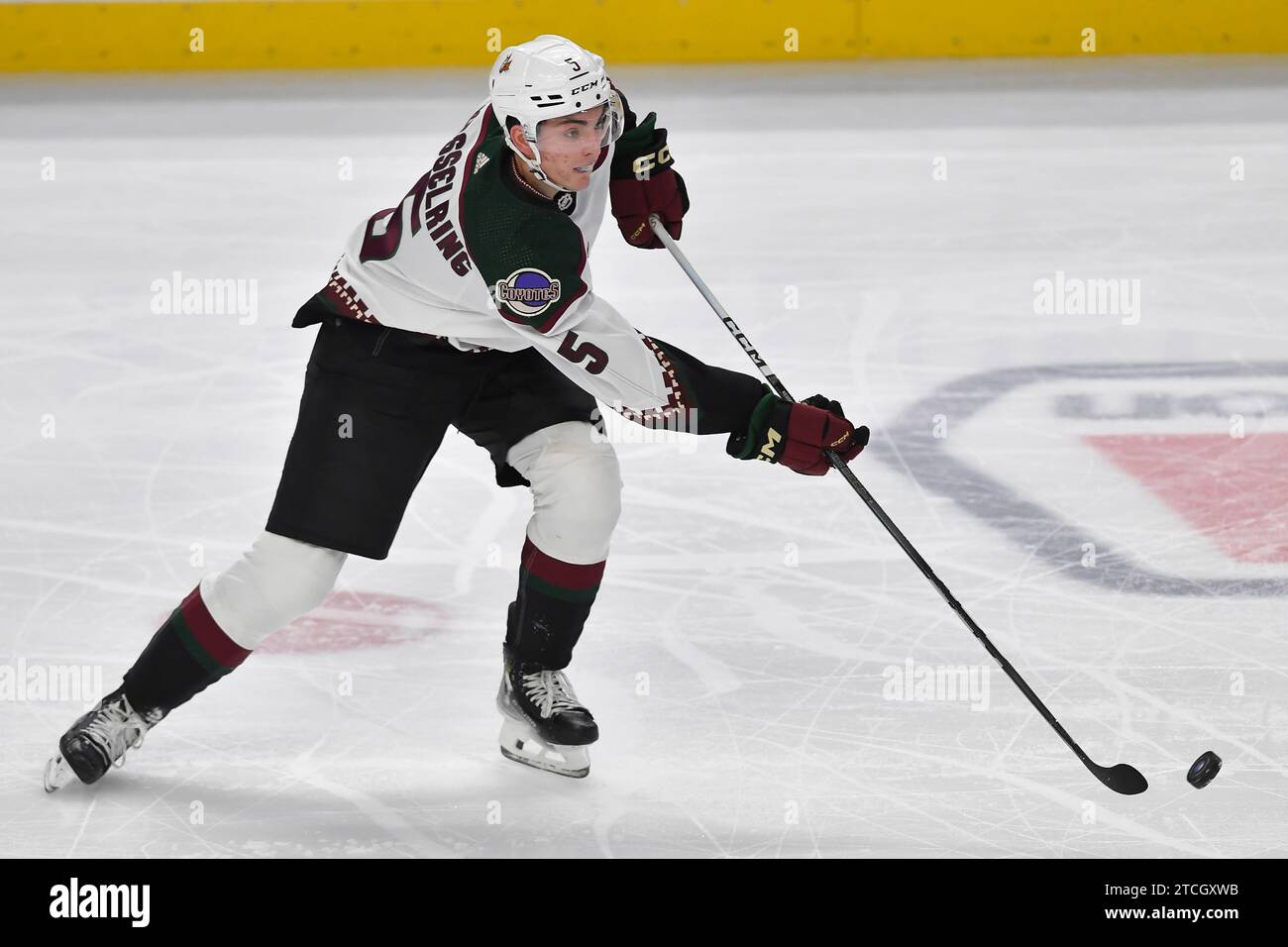 Arizona Coyotes defenseman Michael Kesselring (5) passes the puck ...