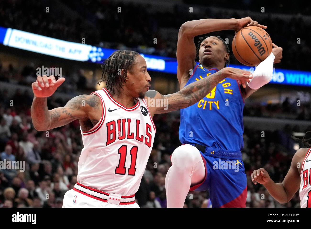 Chicago Bulls forward DeMar DeRozan knocks the ball loose as Denver ...