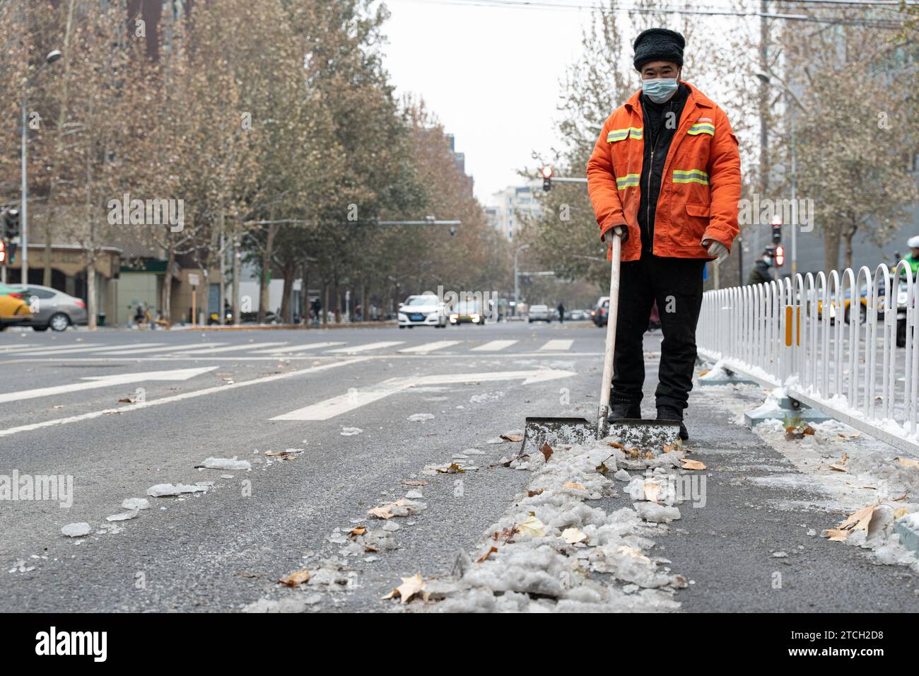 Beijing, China. 13 Dec, 2023. Communal service workers cleaning roads ...