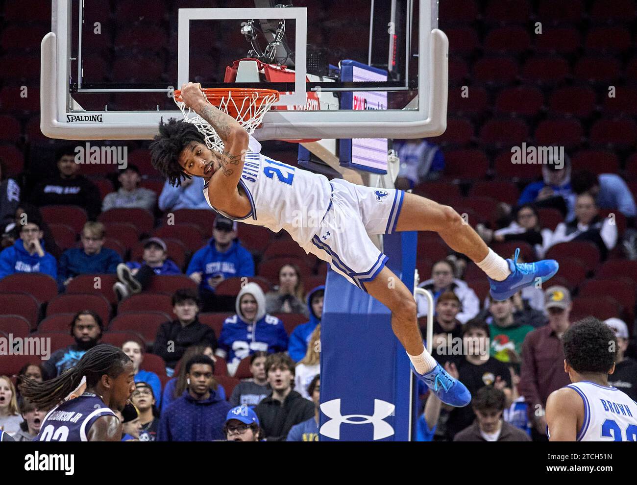 Seton Hall Pirates guard Isaiah Coleman (21) hangs on the rim after a ...