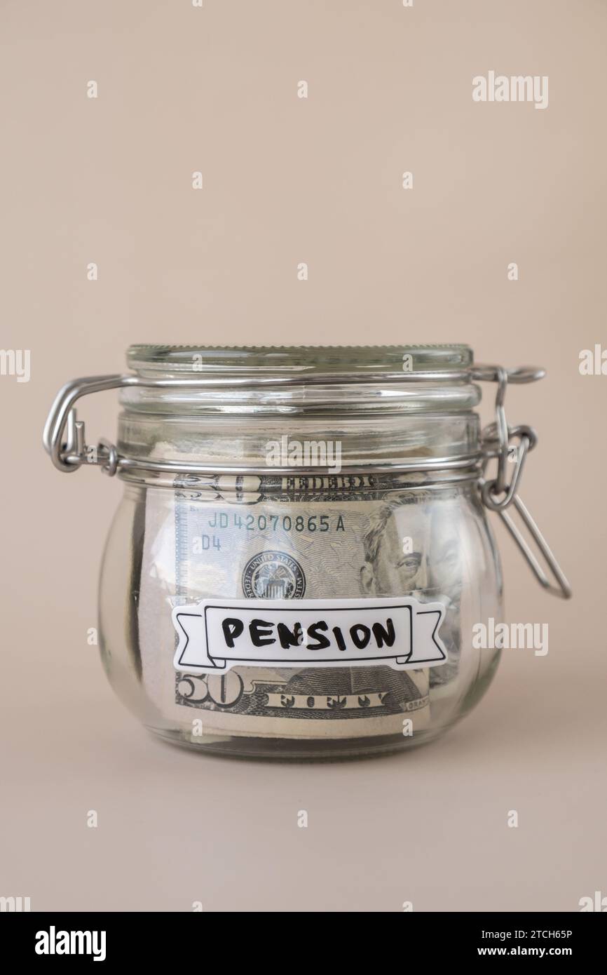 Glass jar full of American currency dollars cash banknote with text ...