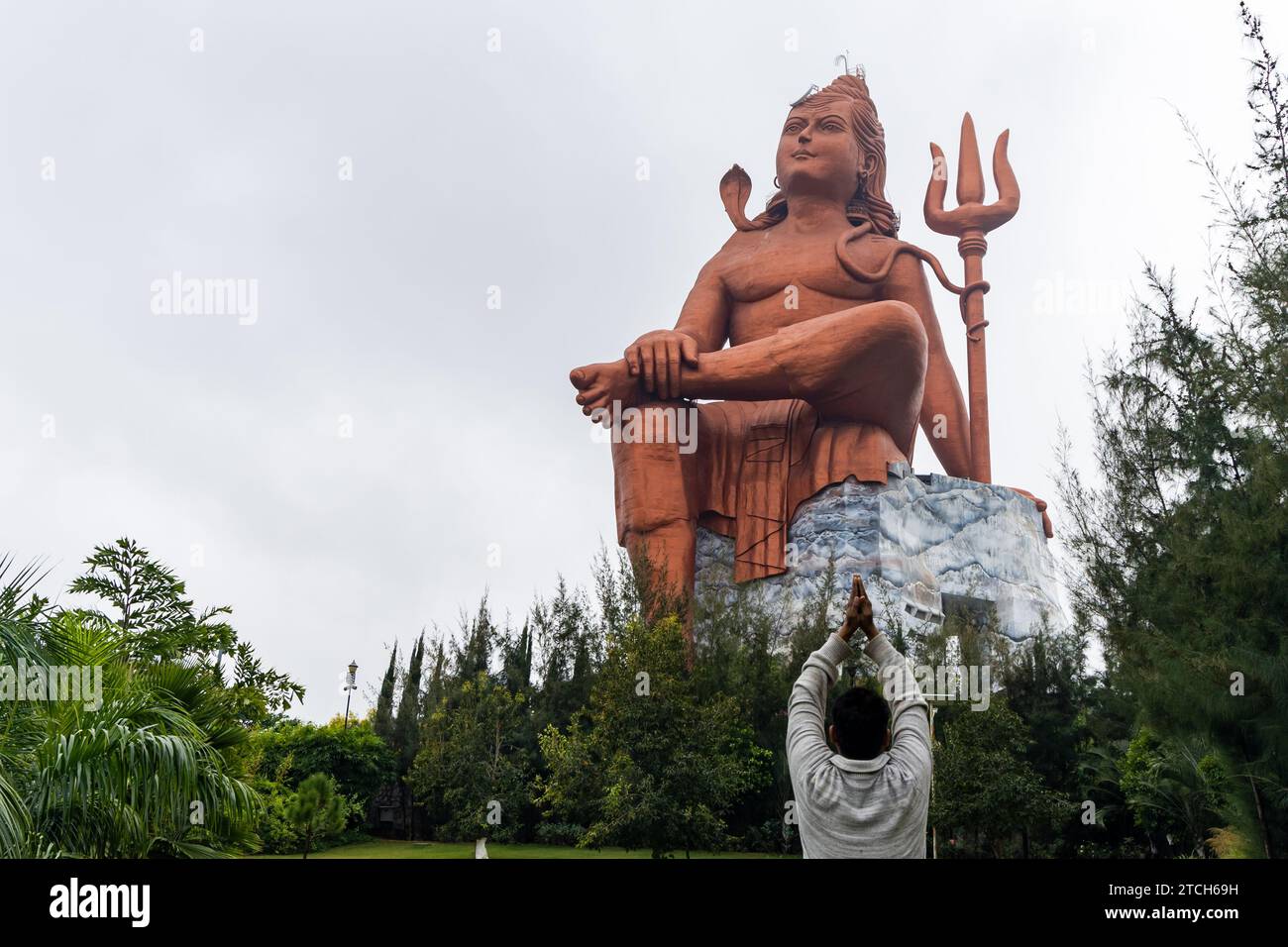 devotee praying to the hindu god lord shiva huge isolated statue at ...