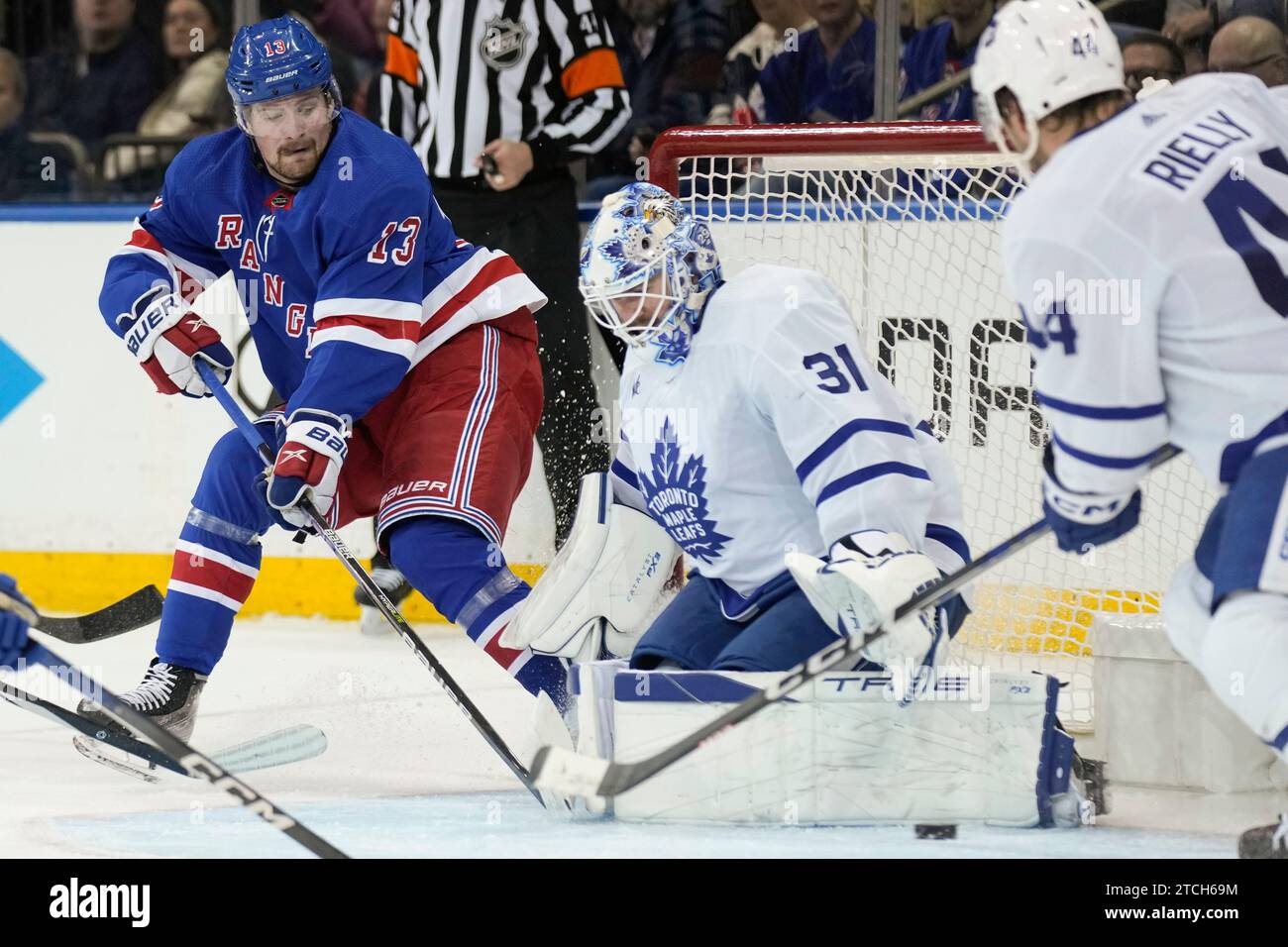 New York Rangers' Alexis Lafreniere (13) tries to get a shot past ...